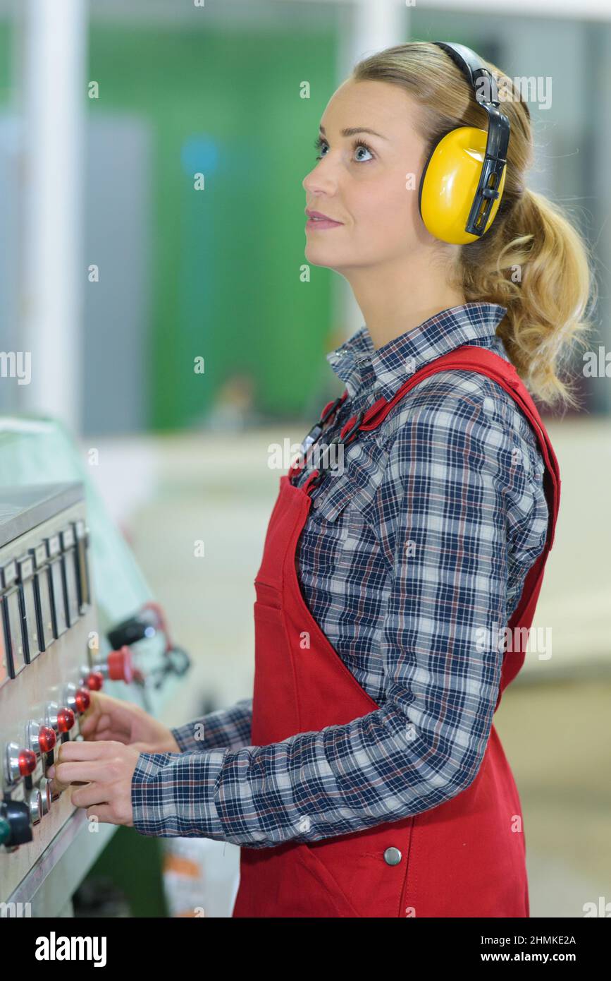 portrait of employee of enterprise looking at machine Stock Photo - Alamy