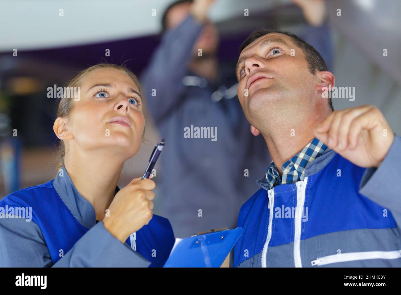 two mechanics are working together Stock Photo - Alamy