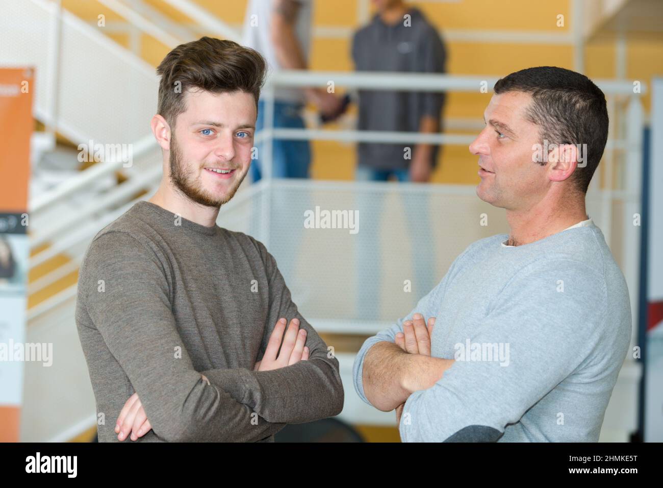 Teacher student talking hallway hi-res stock photography and images - Alamy