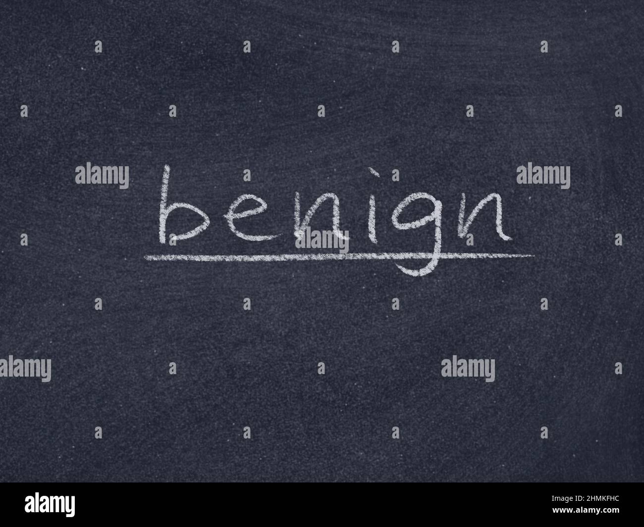 benign concept word on blackboard background Stock Photo - Alamy