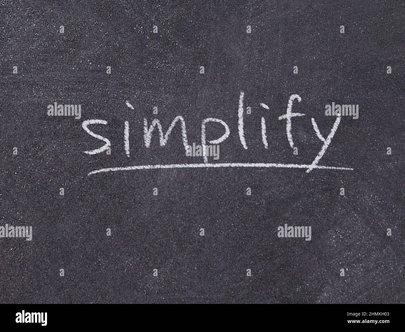 simplify concept word on blackboard background Stock Photo - Alamy