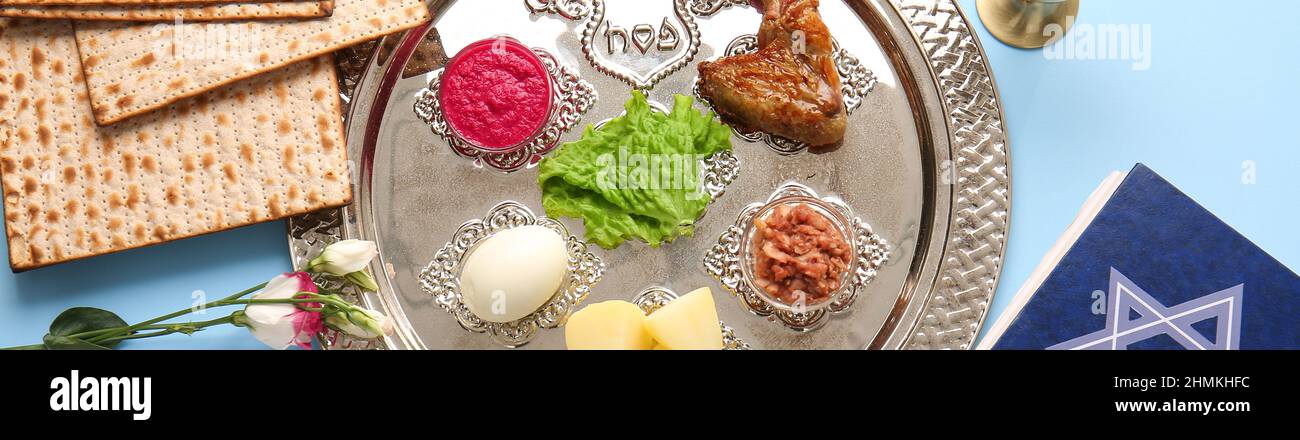 Passover Seder plate with traditional food on blue background Stock ...