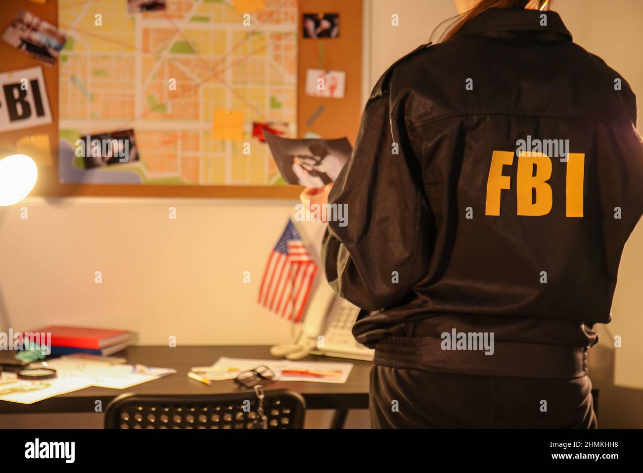 Female detective processing evidence in office Stock Photo - Alamy