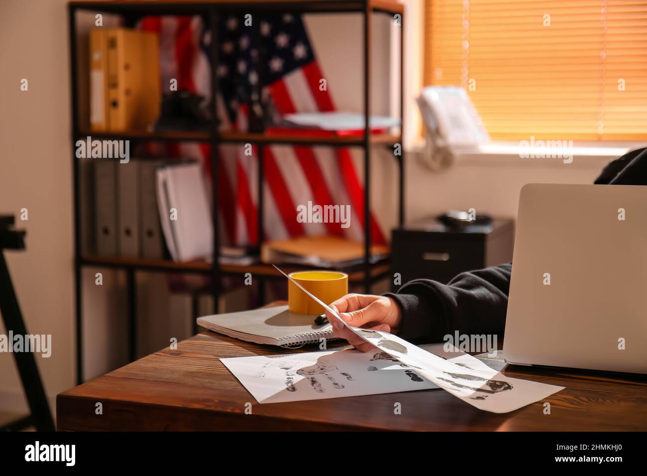 Female detective processing evidence in office Stock Photo - Alamy