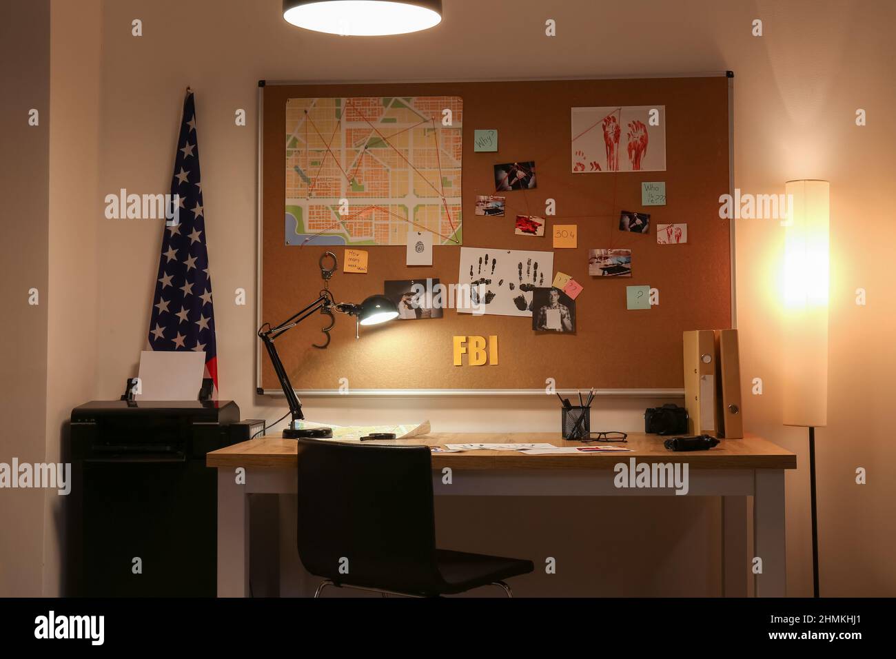 Workplace of FBI agent in office at night Stock Photo - Alamy