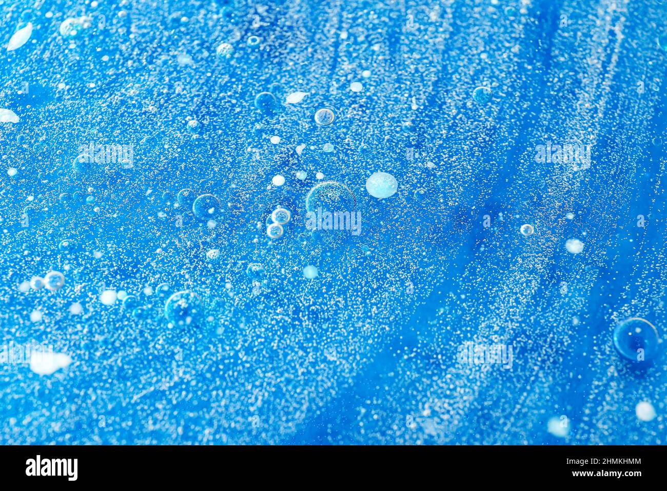 Solid water bubbles on blue background Stock Photo - Alamy