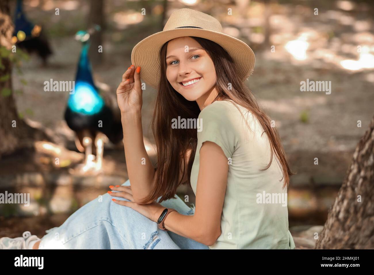 Beautiful female tourist in zoo Stock Photo - Alamy
