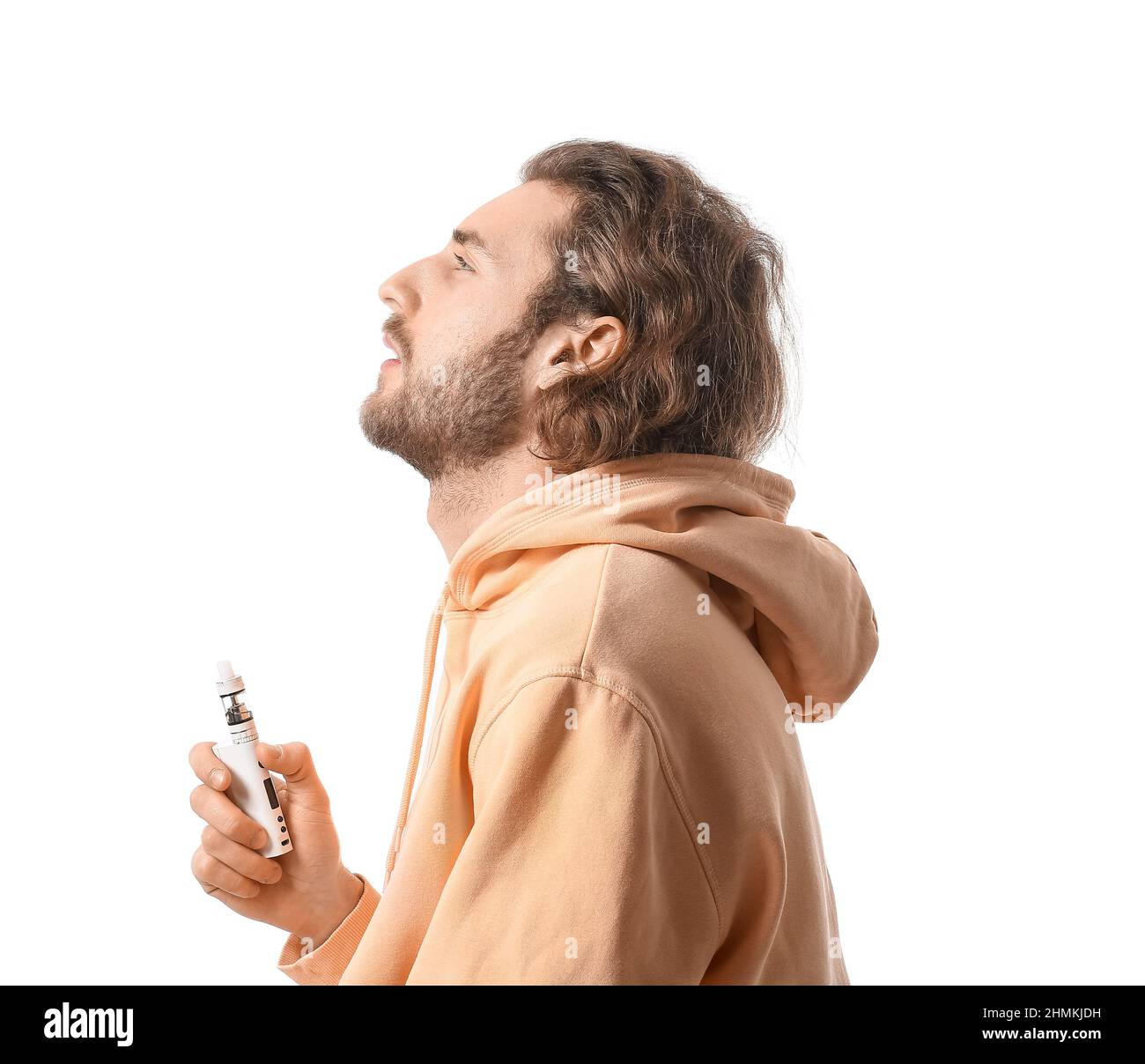 Vaping young man on white background Stock Photo - Alamy