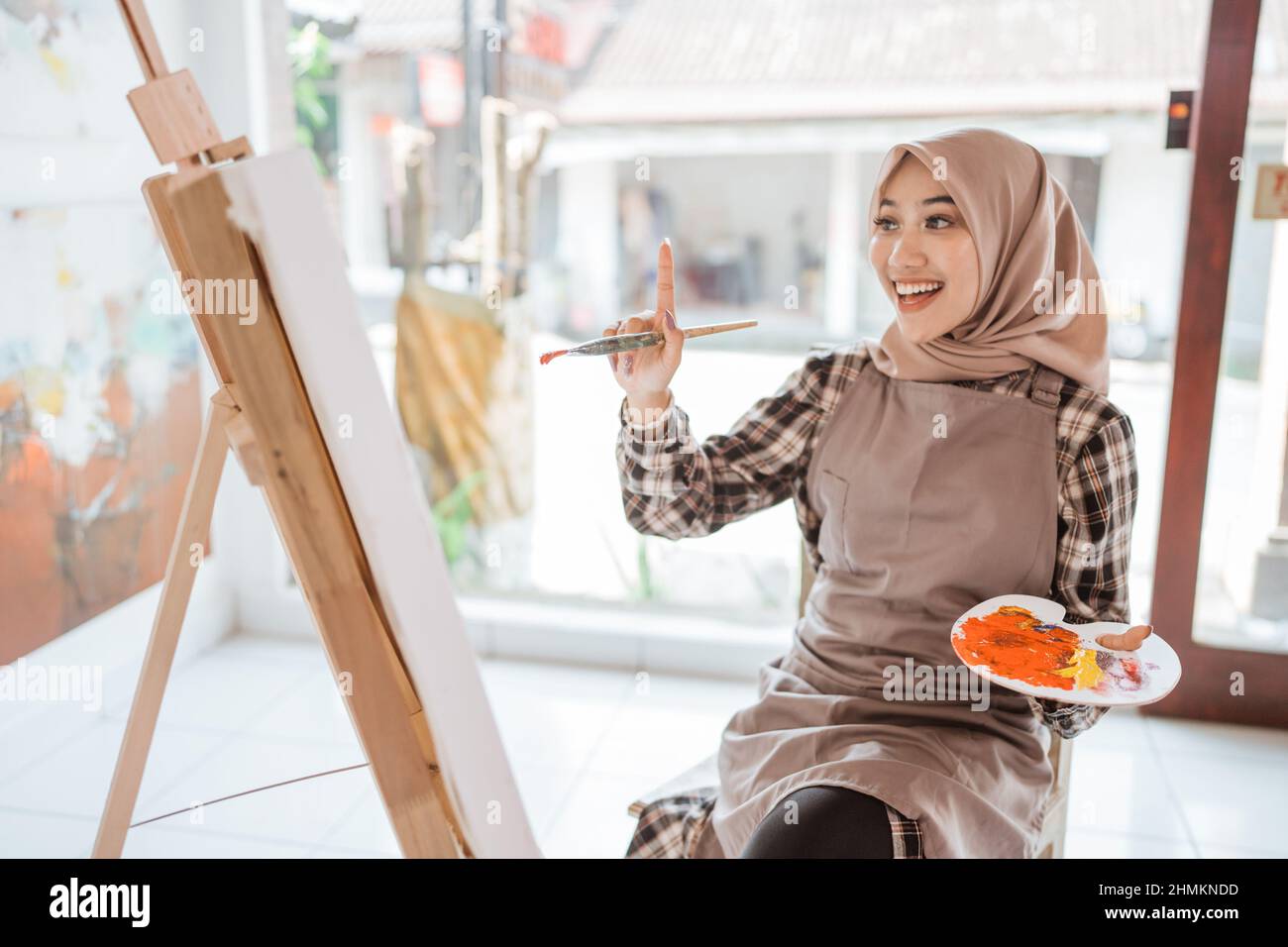 muslim artist painter thinking about what to paint Stock Photo - Alamy