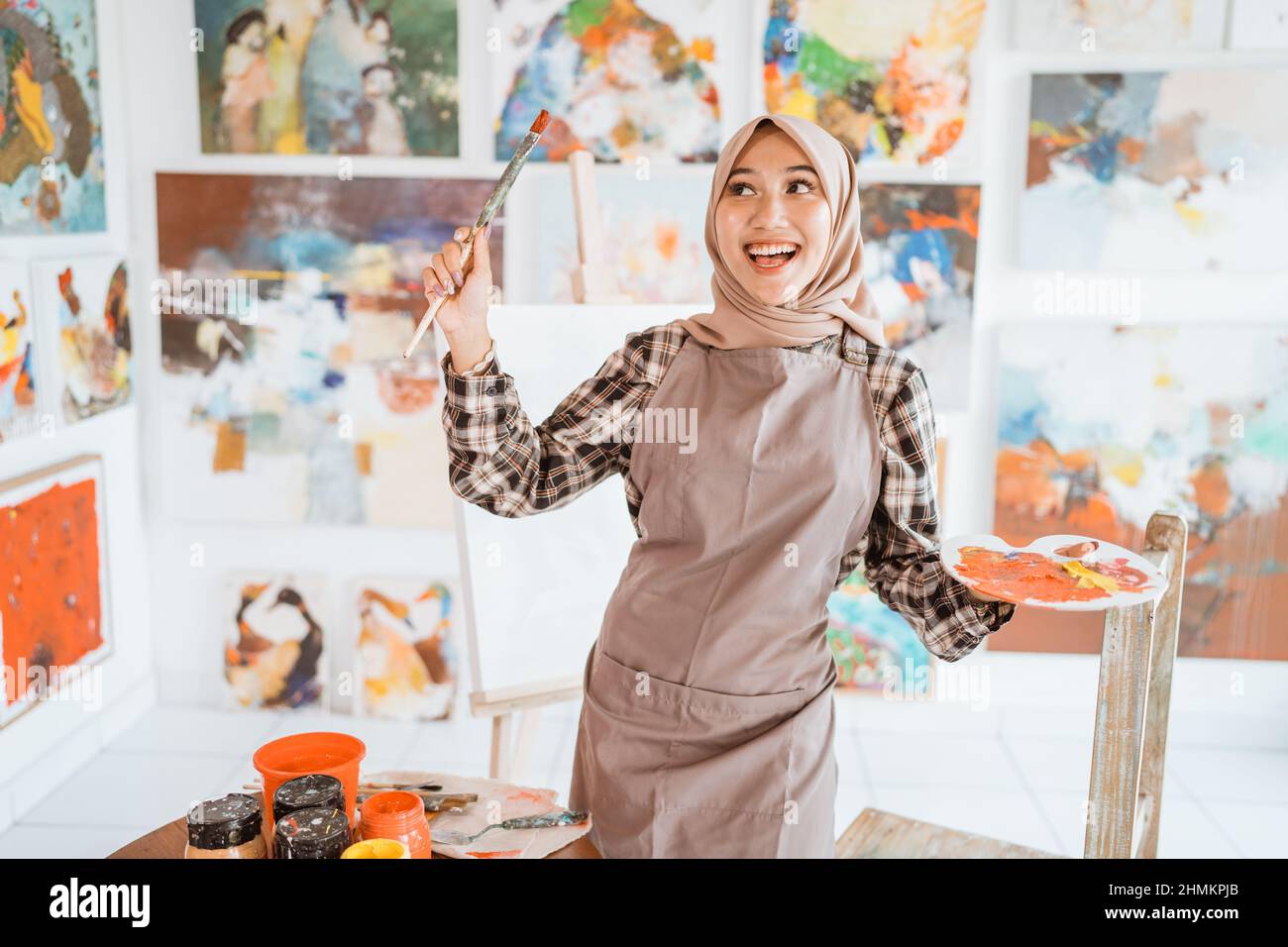 muslim artist painter thinking about what to paint Stock Photo - Alamy