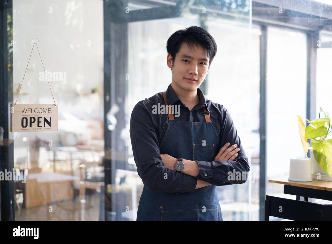 Portrait of Asian Man barista cafe owner smile while cafe open. SME ...