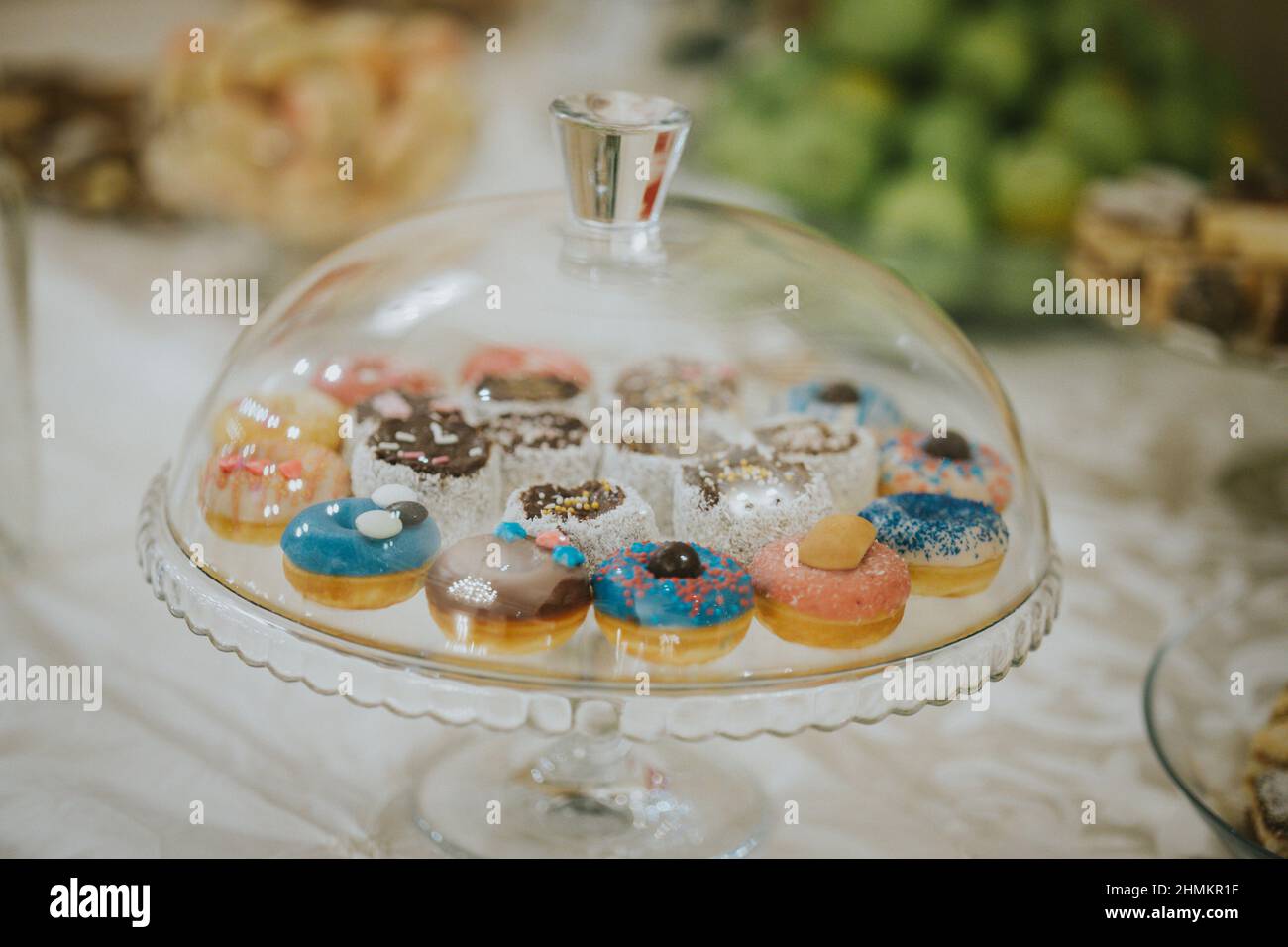Plate of donuts with colorful creamy decoration for an event Stock ...