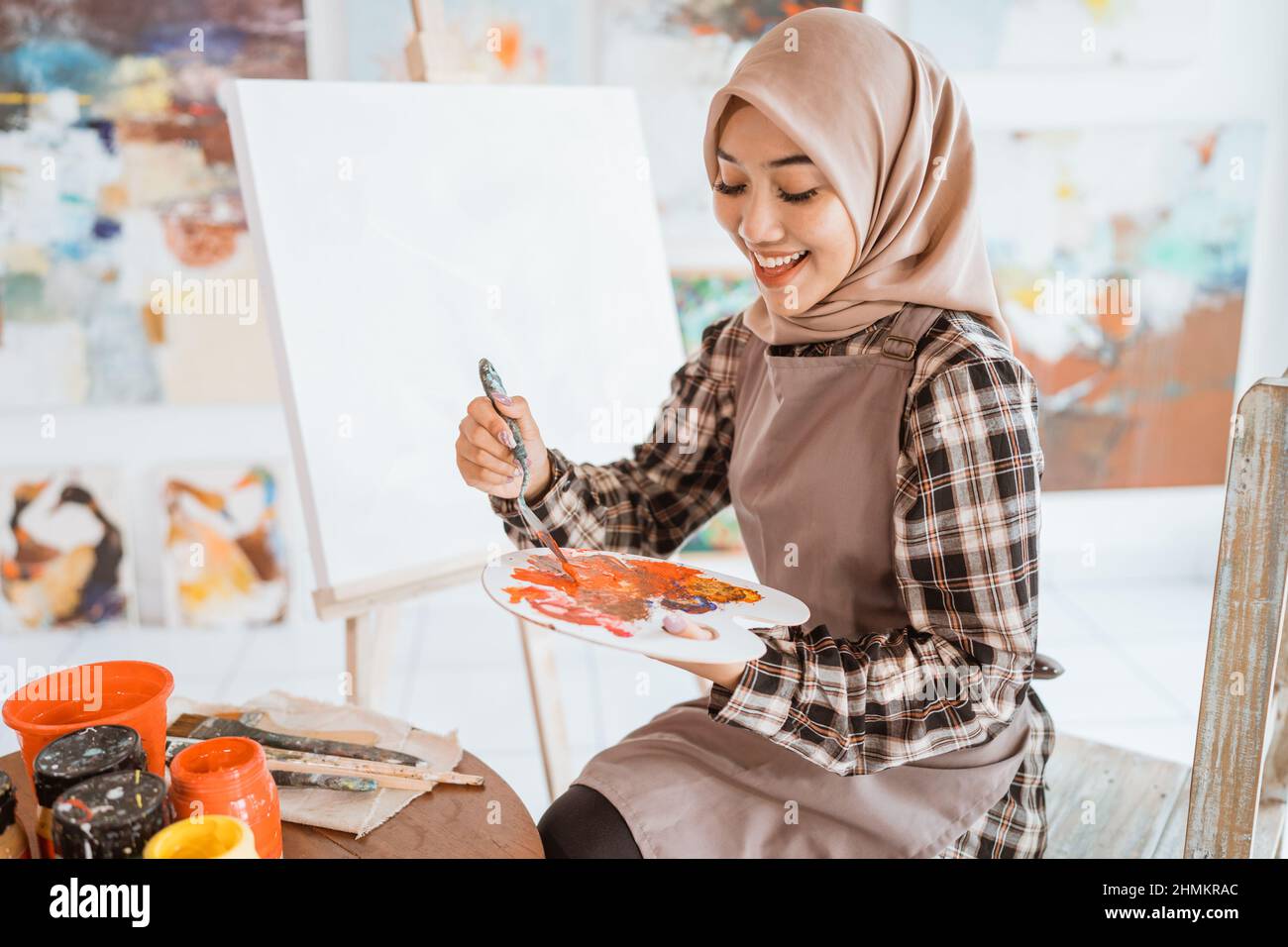 Muslim asian female artist painting hi-res stock photography and images ...