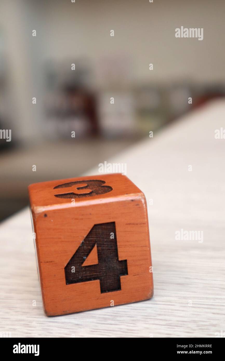 small wooden cube with numbers 4 Stock Photo - Alamy
