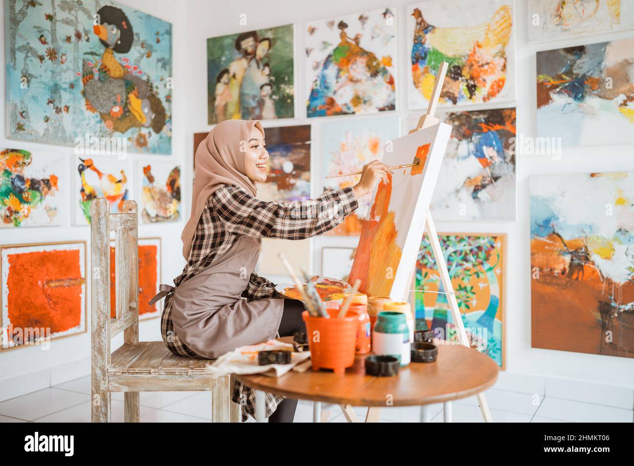 Asian artist painting sitting on hi-res stock photography and images ...