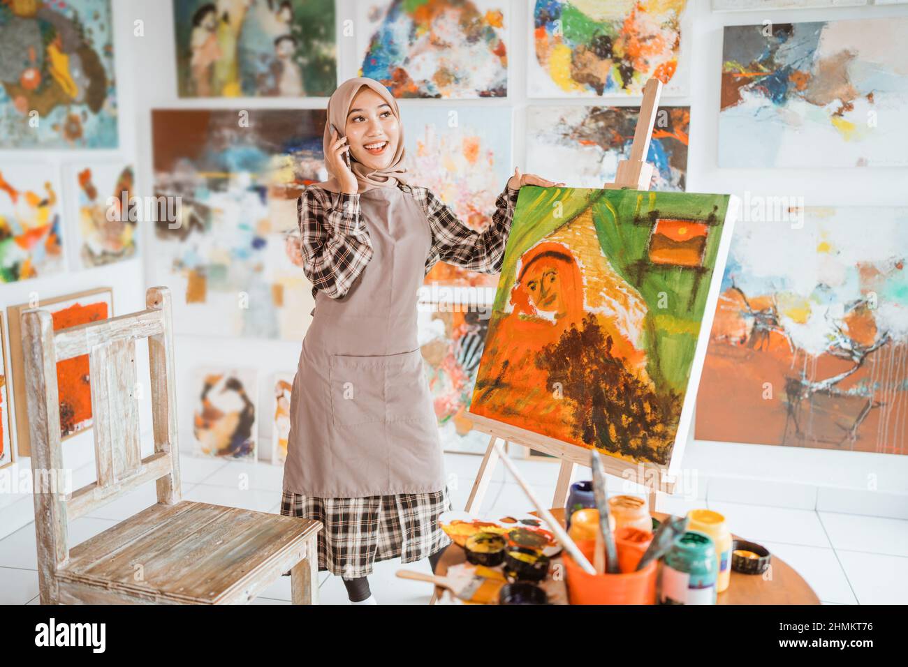 Muslim asian female artist painting hi-res stock photography and images ...