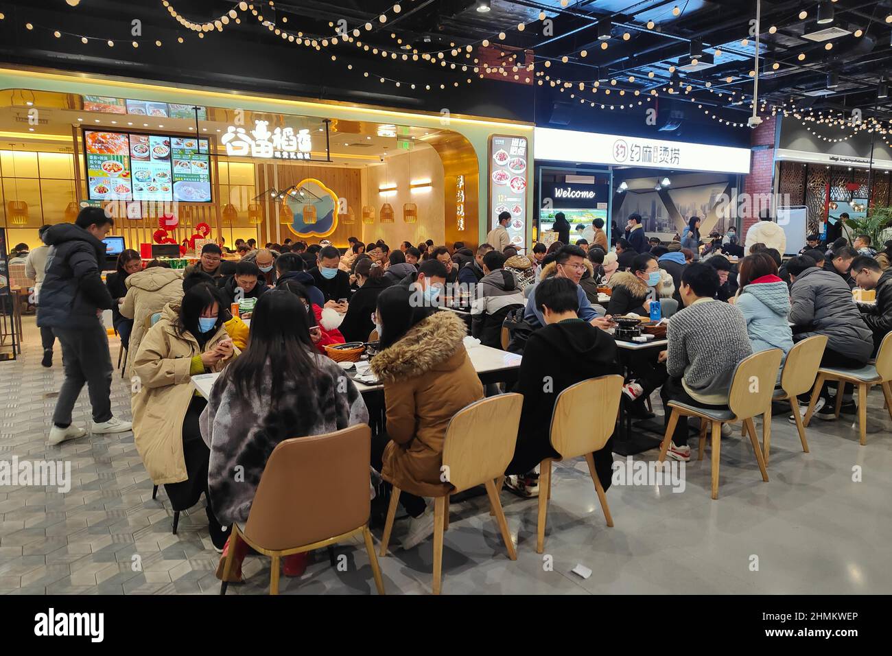 SHANGHAI, CHINA - FEBRUARY 10, 2022 - White-collar workers eat at a ...