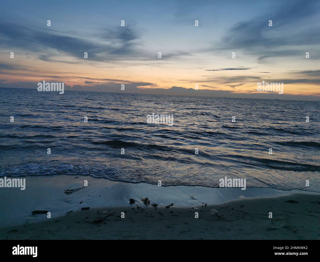 Beautiful view of sea waves at beach during the sunset Stock Photo - Alamy
