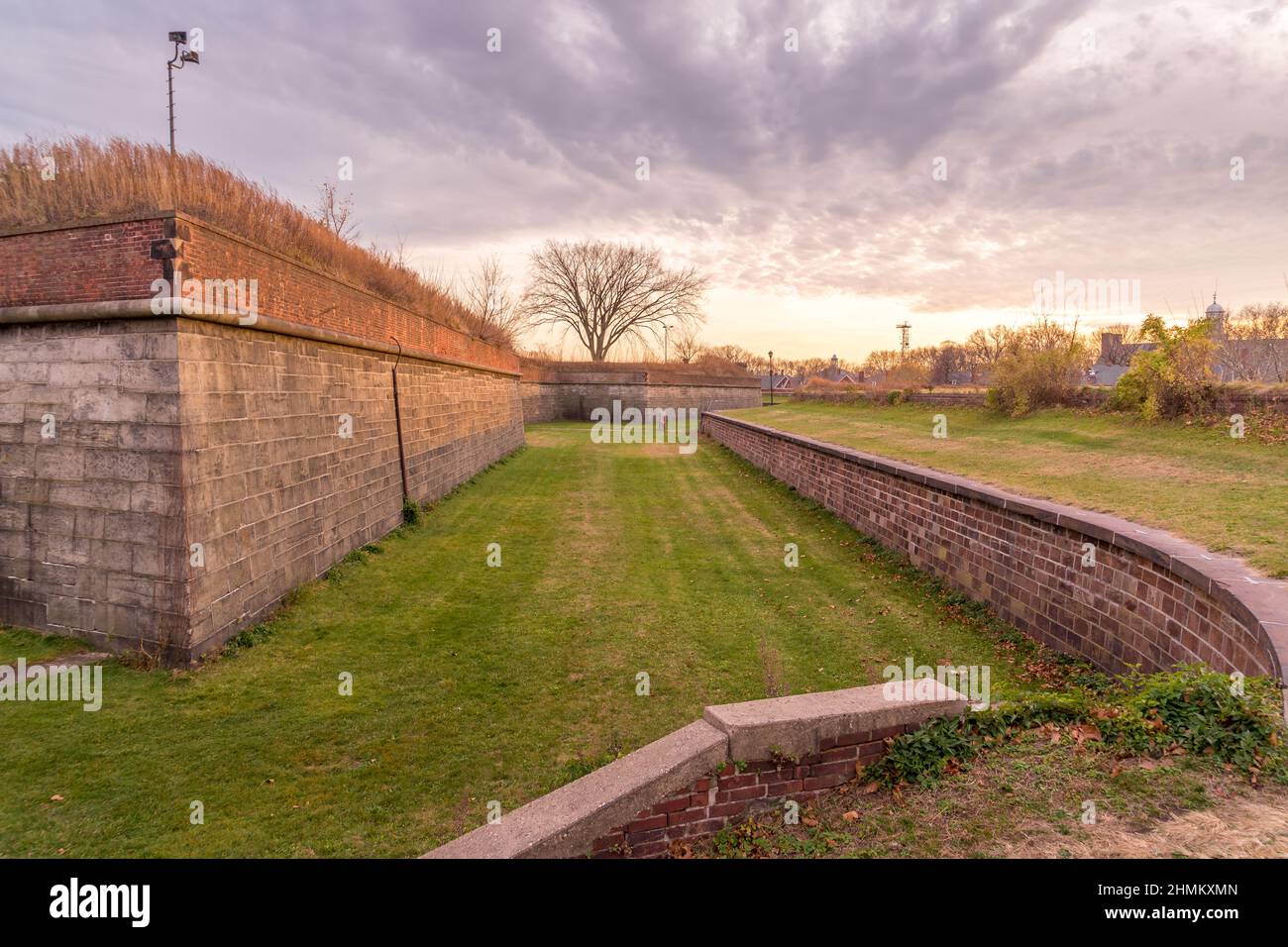 Fort Jay on Governor's island with dramatic sunset sky Stock Photo - Alamy