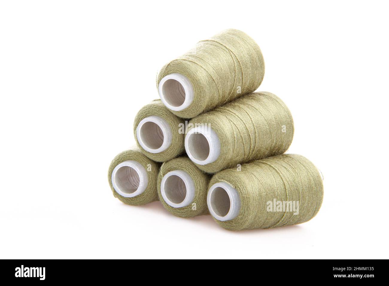 Green spool of thread isolated on white background. Skein of woolen ...