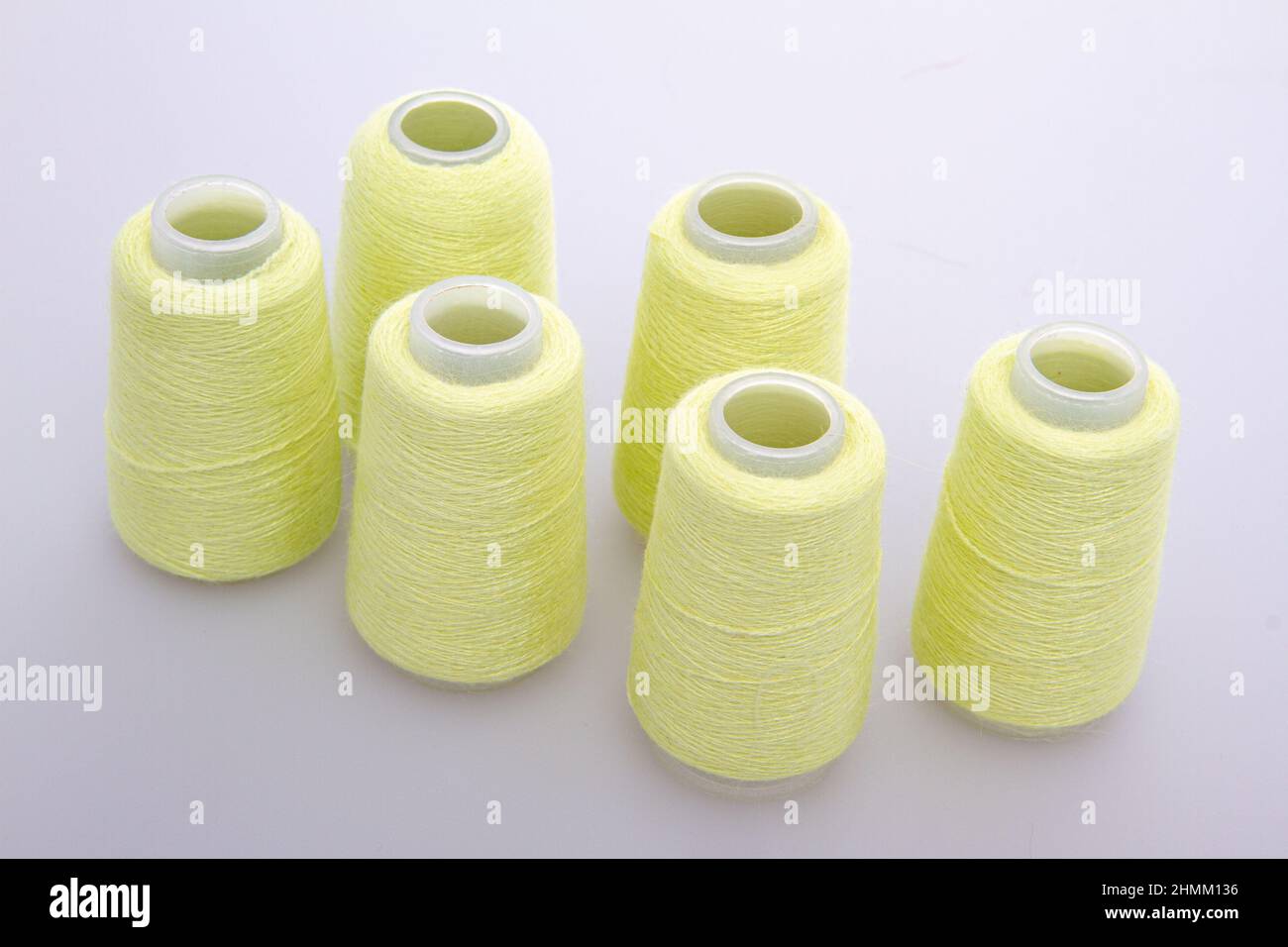 Yellow spool of thread isolated on white background. Skein of woolen ...