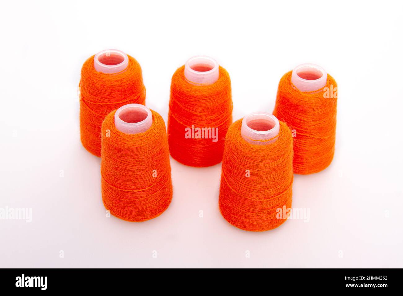 Red spool of thread isolated on white background. Skein of woolen ...