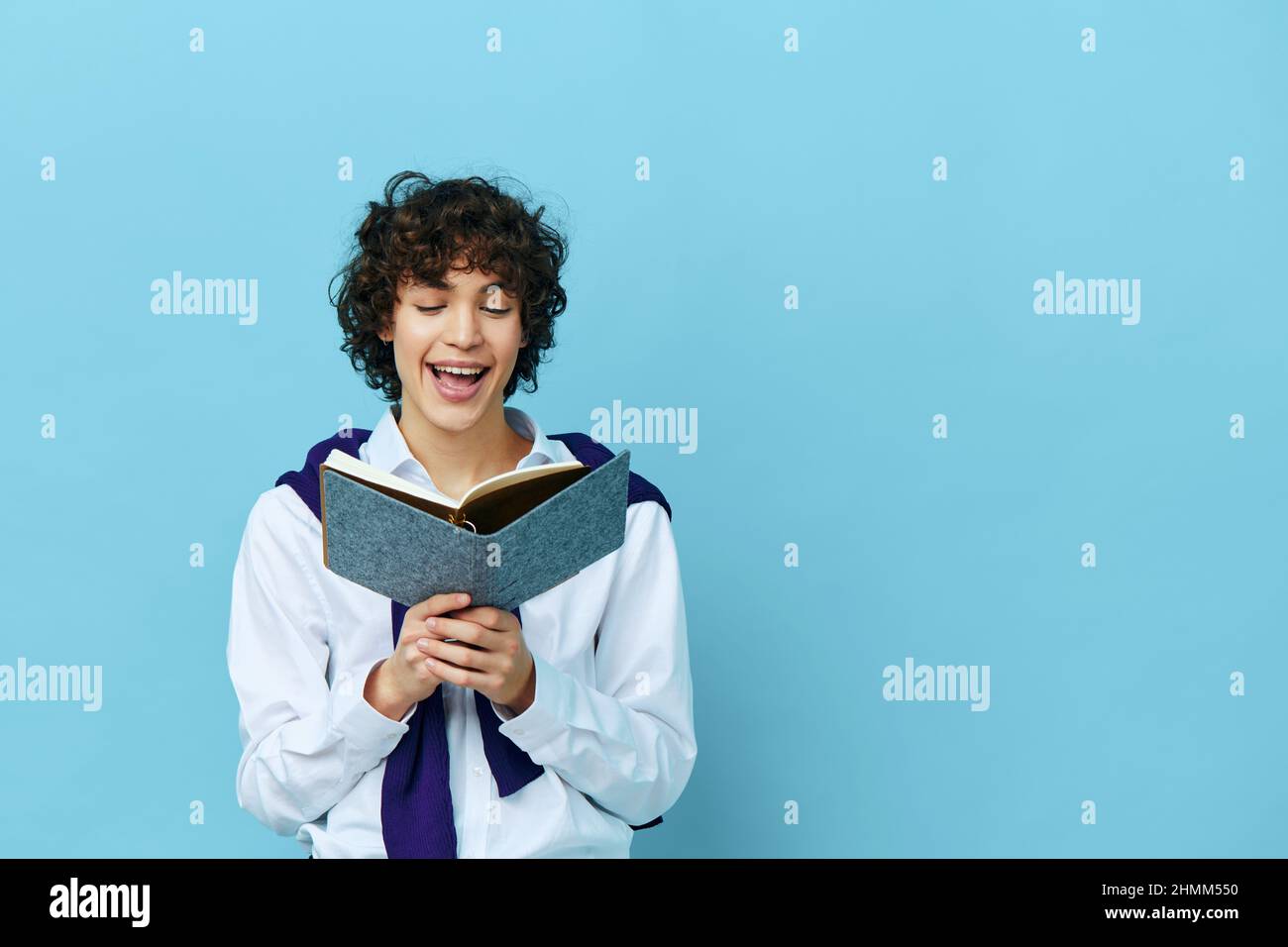 student education with notepad hand gesture blue background Stock Photo ...