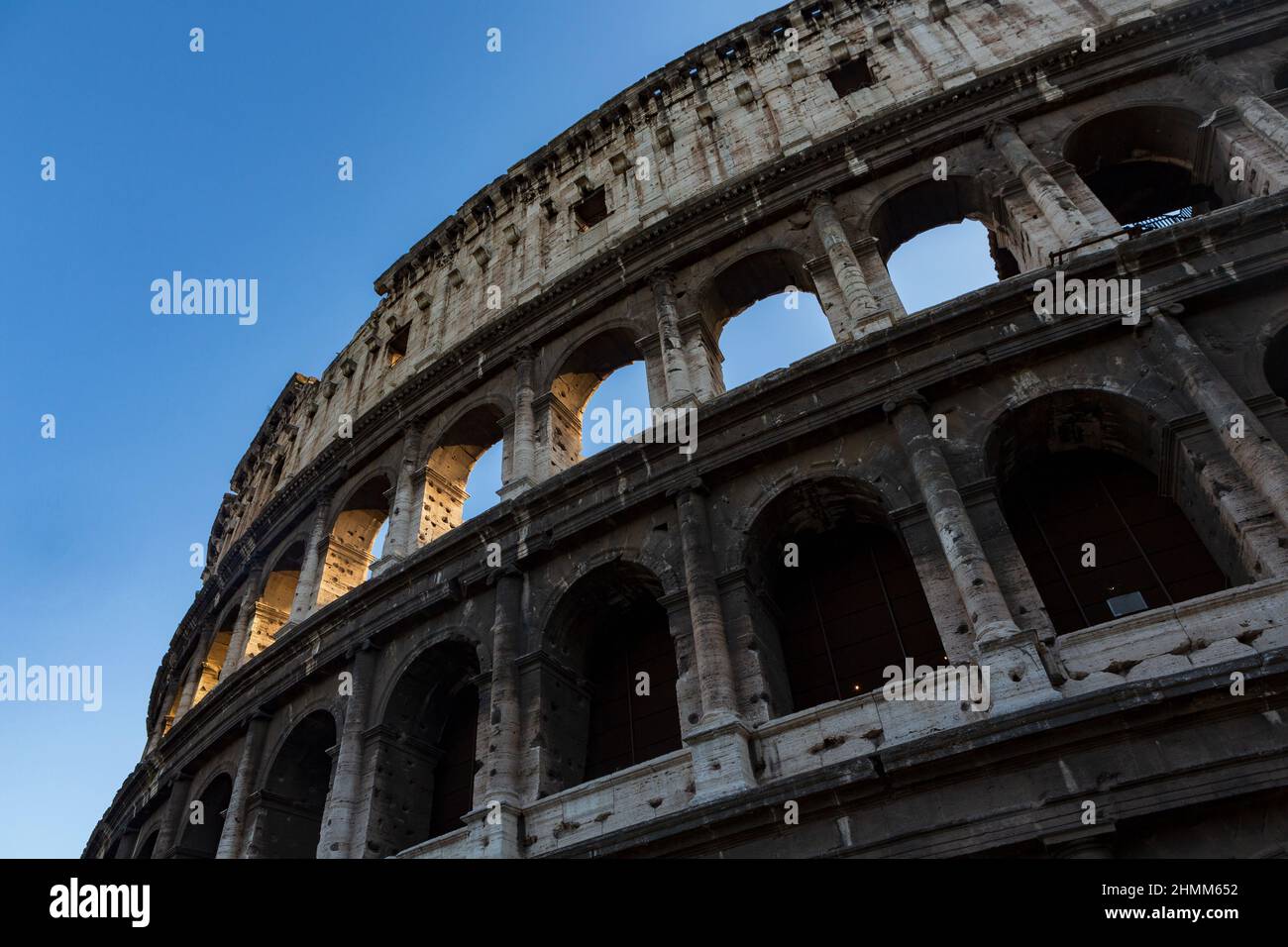 The sun sets on the Colosseum in Rome, Italy, the largest ancient ...