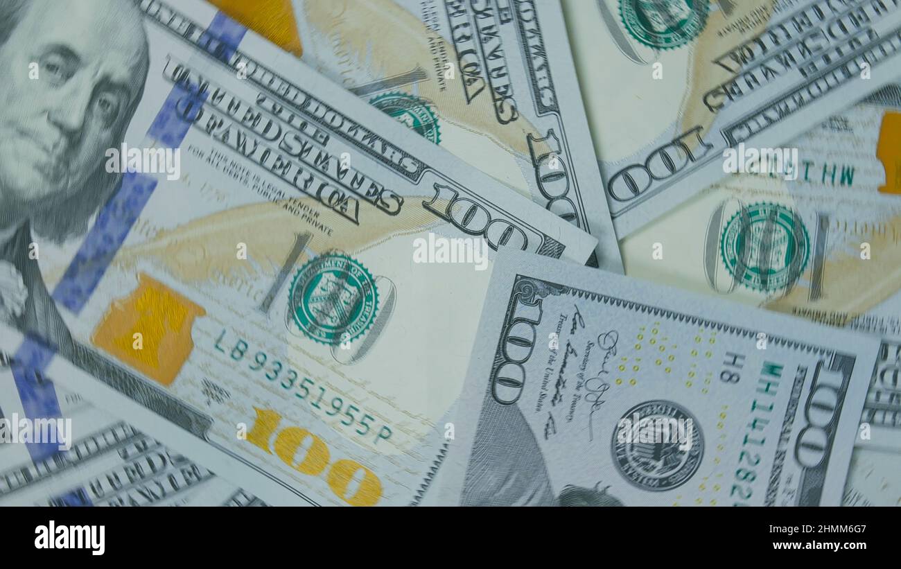 Many dollar are arranged around the edges of the image as a frame ...