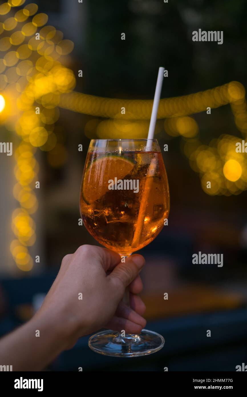 Aperol spritz summer cocktail in mister glass with lime, eco friendly ...