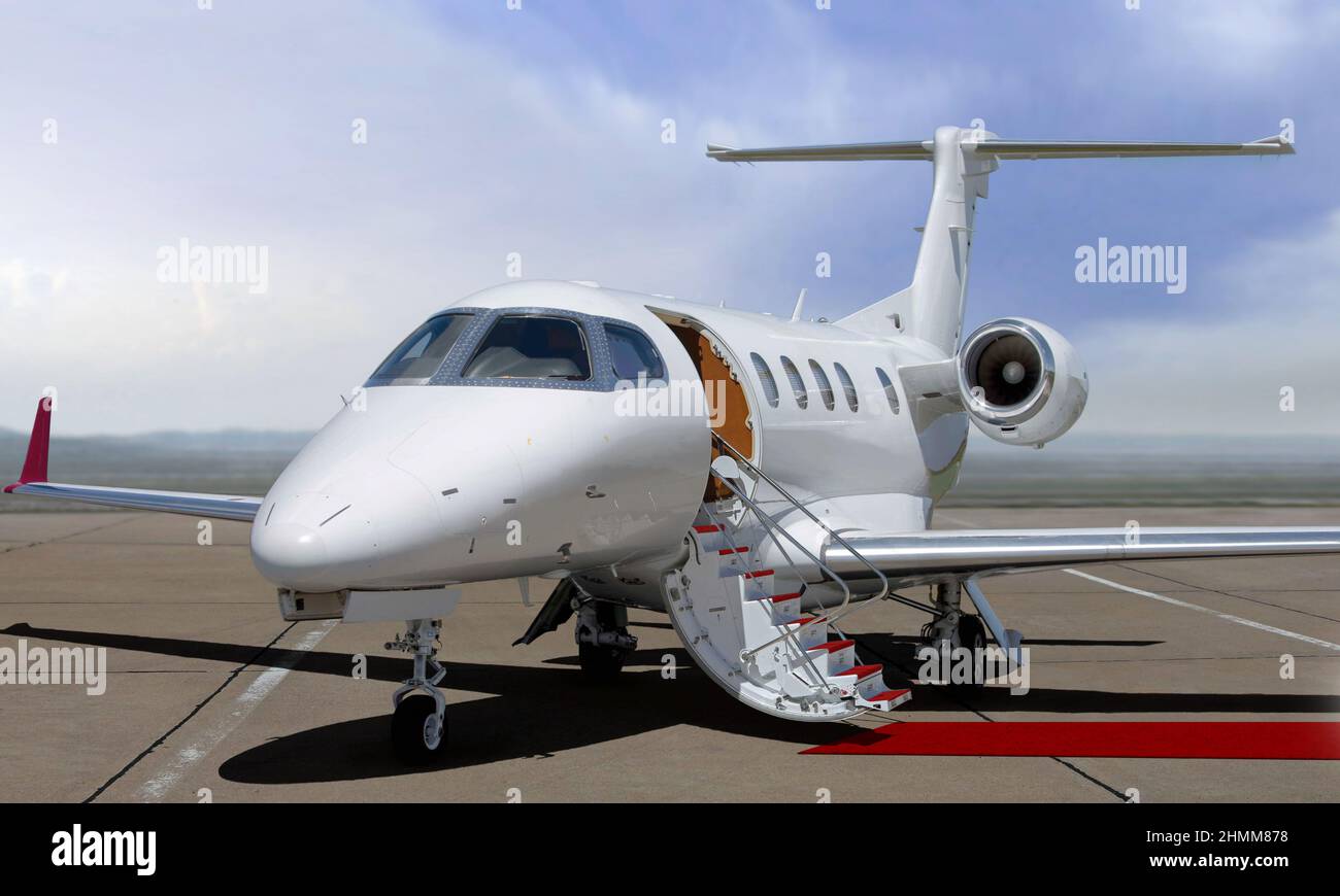 Private jet with red carpet in open airfield Stock Photo - Alamy