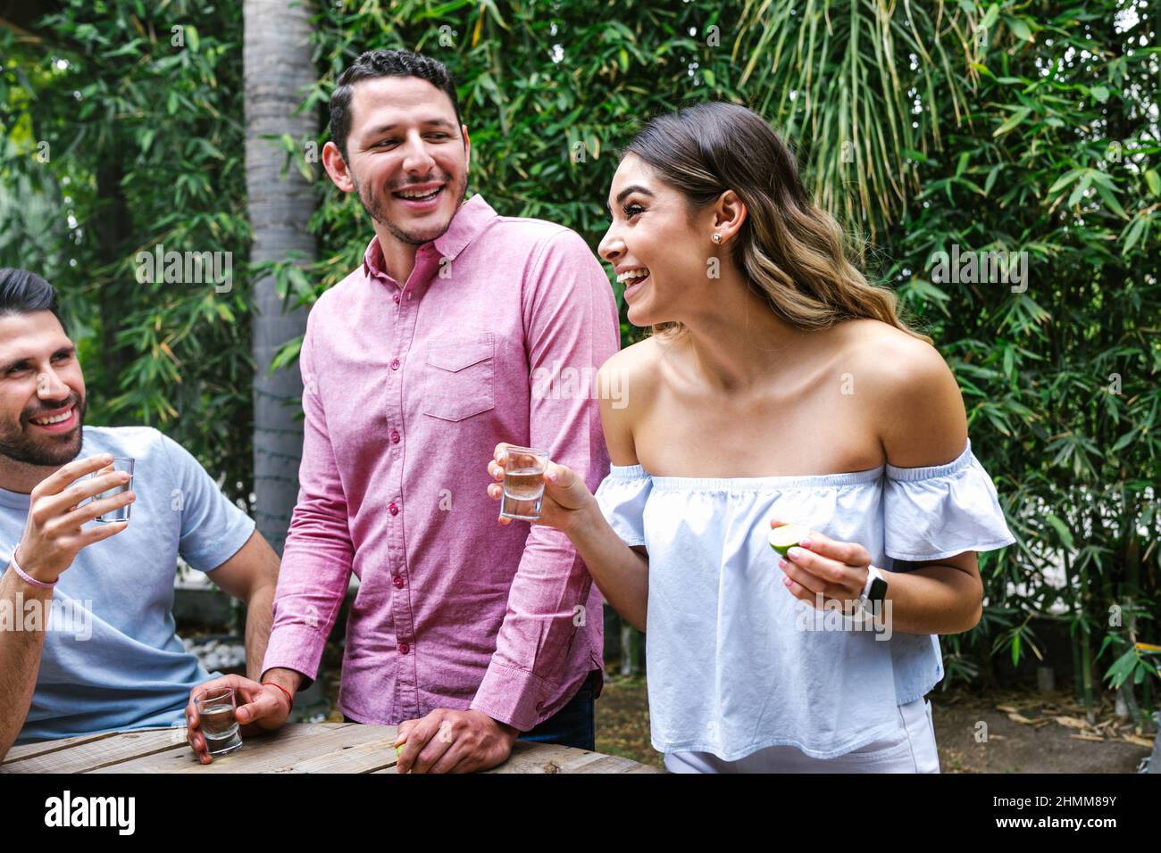 Group of Young latin Friends Meeting For beer, michelada Drinks And ...
