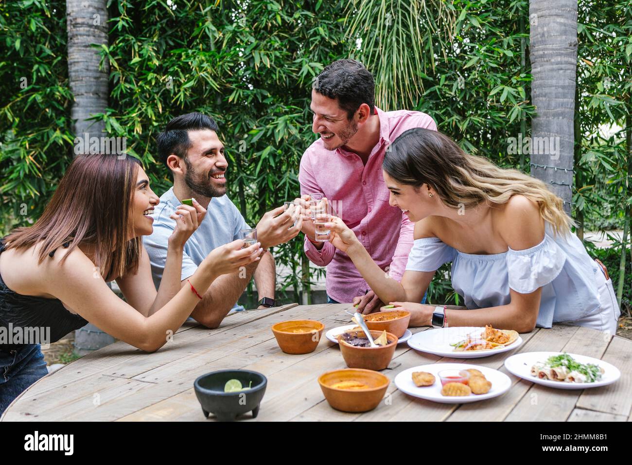 Group of Young latin Friends Meeting For beer, michelada Drinks And ...