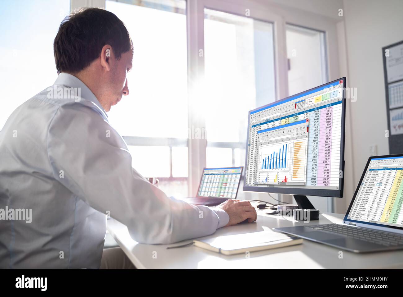 Analyst Working With Spreadsheet Business Data On Computer Stock Photo ...