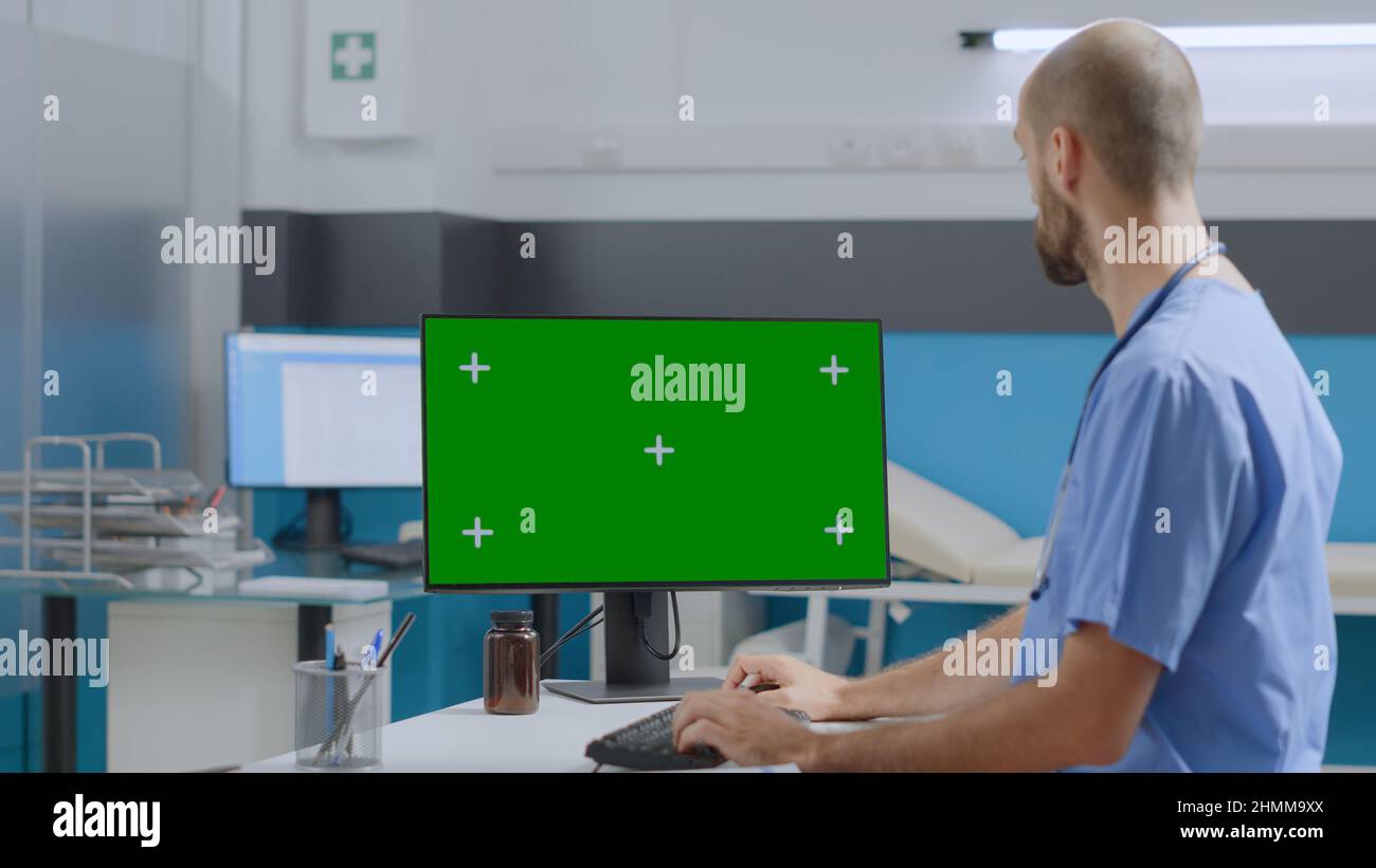 Physician assistant sitting at desk working at sickness expertise ...