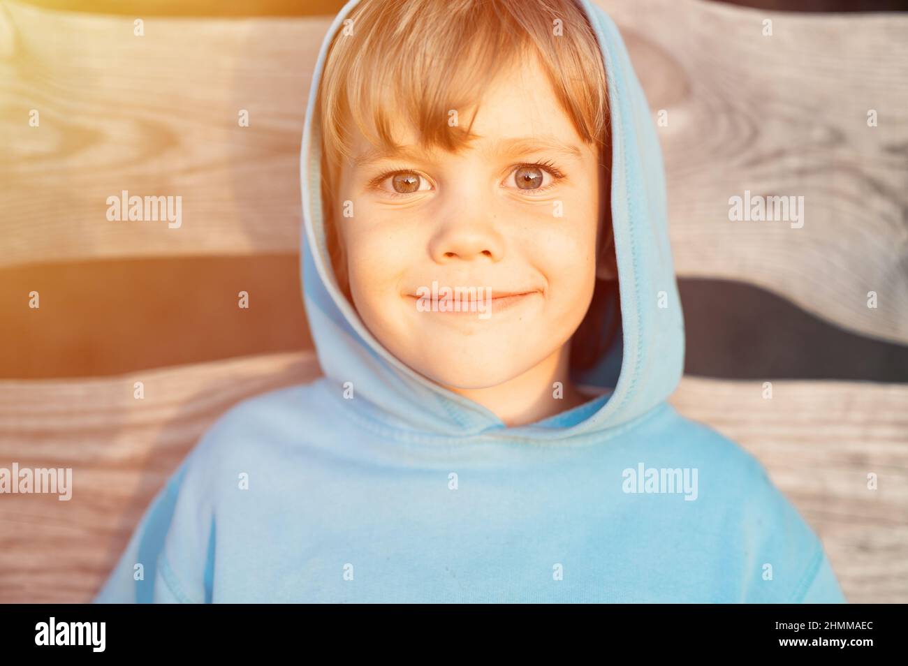 portrait of face happy smiling candid five year old kid boy in blue ...
