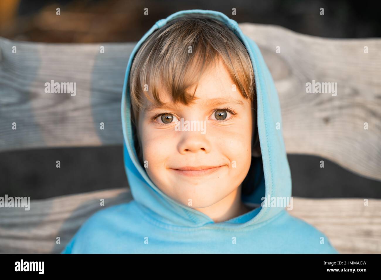 portrait of face happy smiling candid five year old kid boy in blue ...