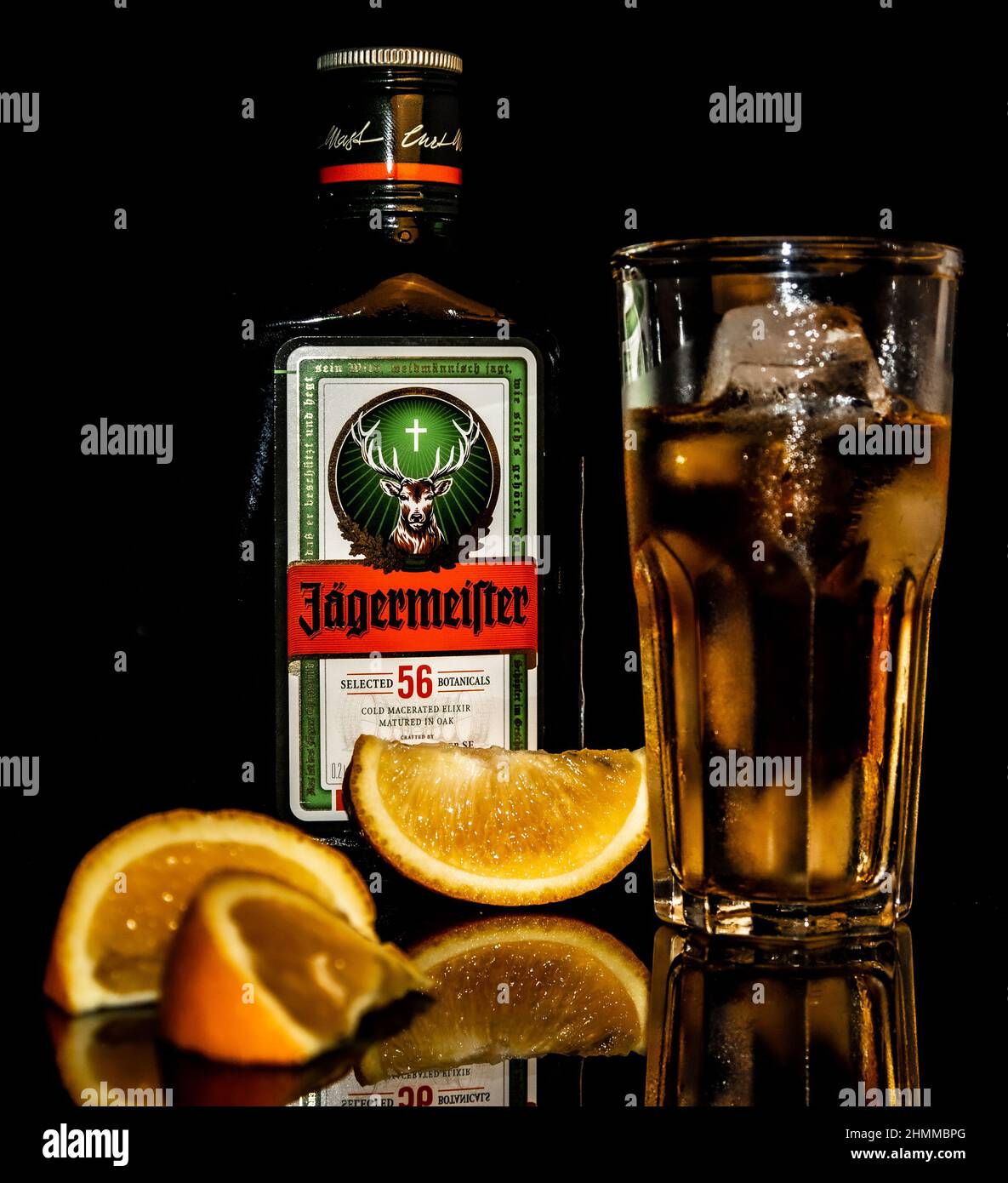Closeup of Jagermeister with an alcohol cocktail and oranges isolated ...