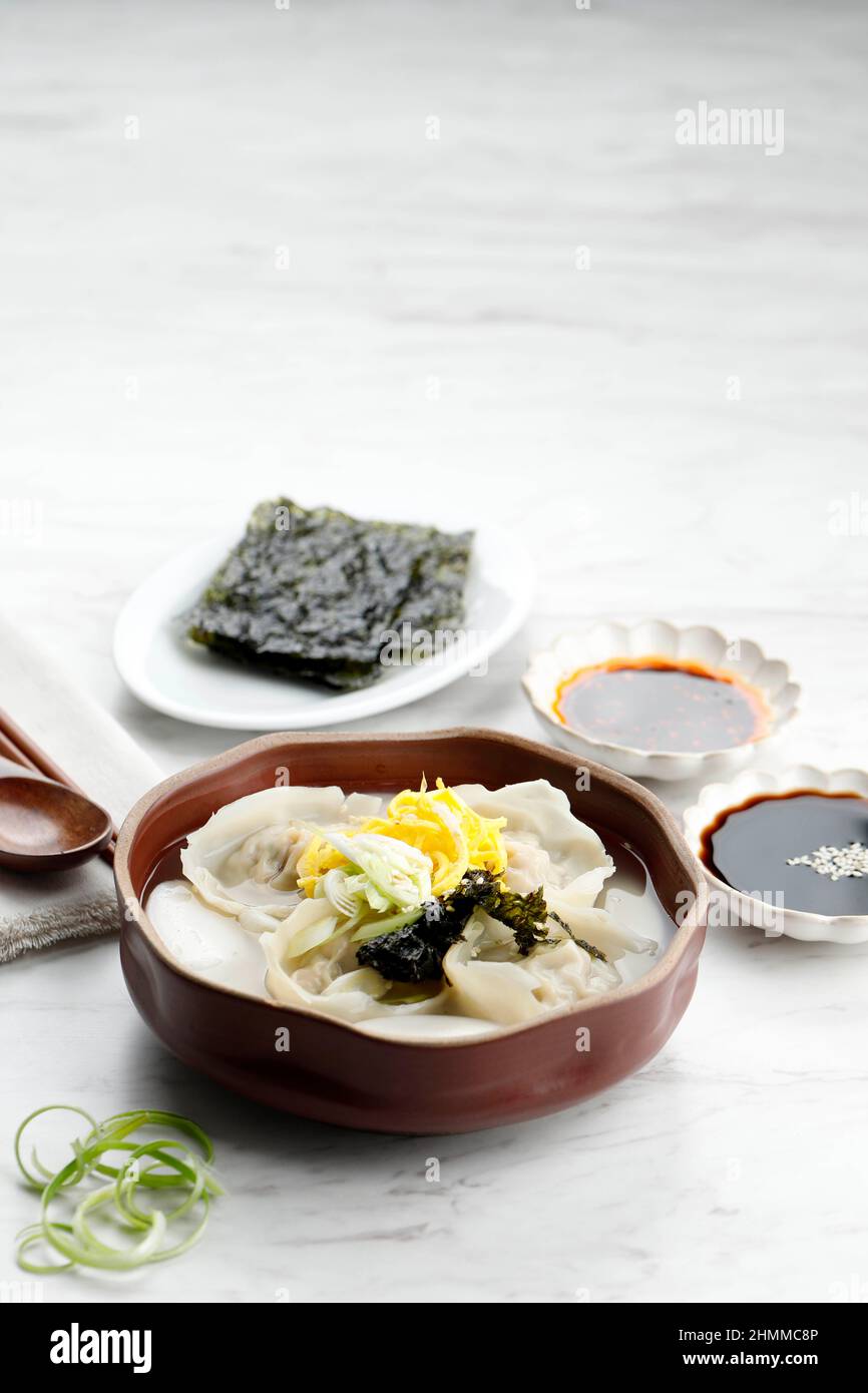 Tteok Mandu Guk, Korean Dumpling and Rice Cake Soup, Copy Space for ...