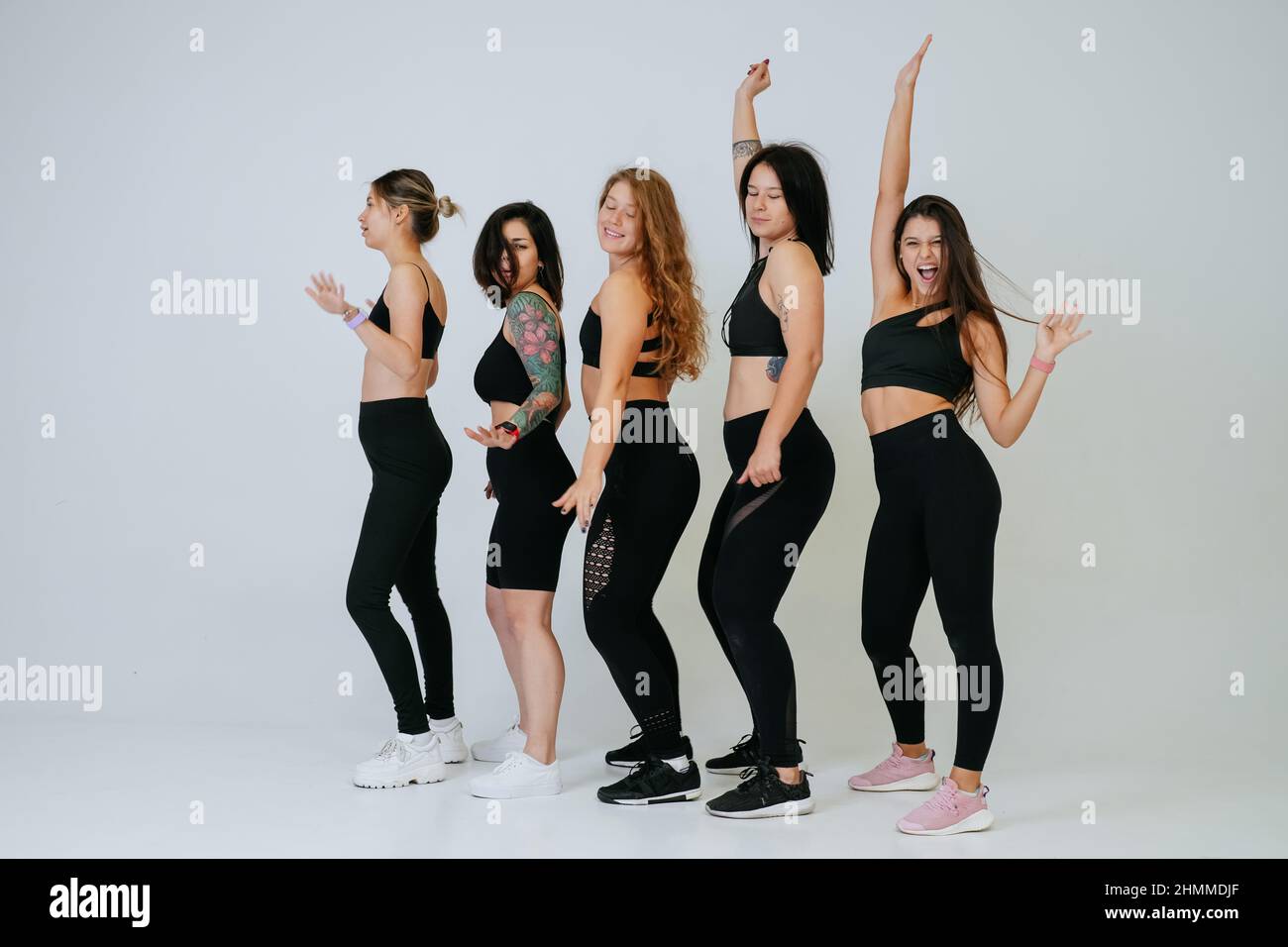 diverse models laughing, enjoying time together, look at camera Stock ...