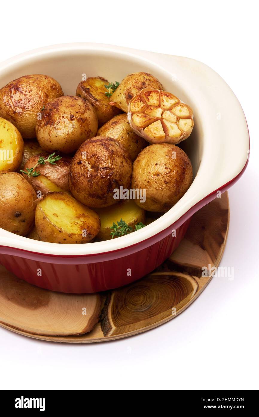 Baked potato in a clay pot isolated on white background Stock Photo - Alamy