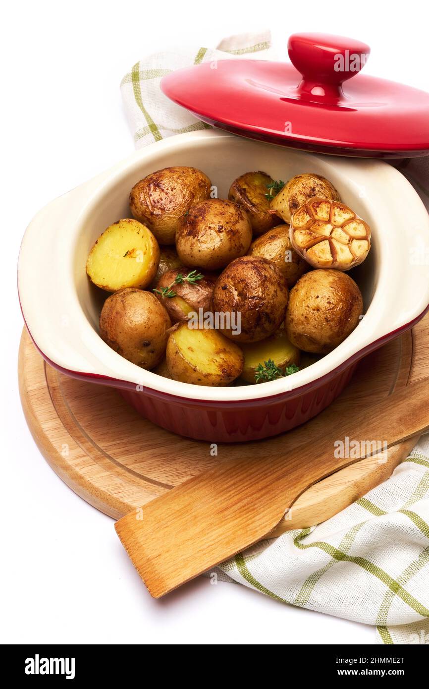 Baked potato in a clay pot isolated on white background Stock Photo - Alamy