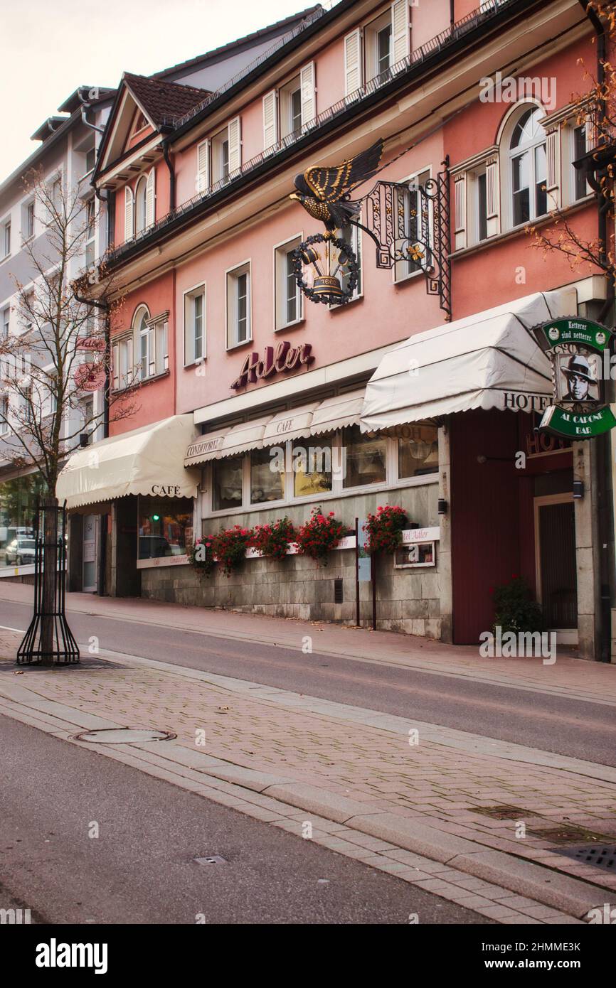 Iron guild sign hanging outside a store in Triberg, Germany. These ...