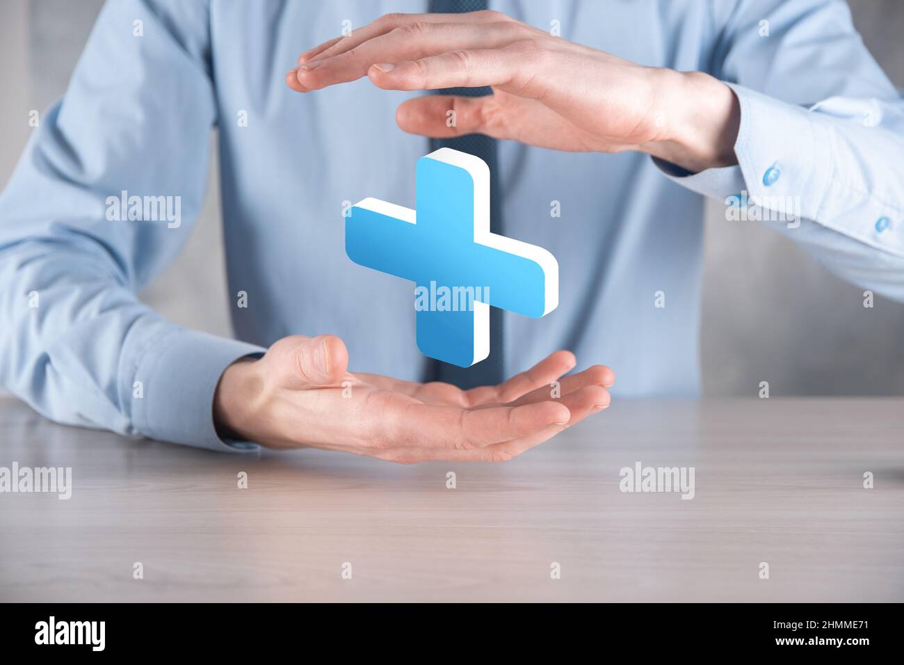 Businessman hold 3D plus icon, man hold in hand offer positive thing ...
