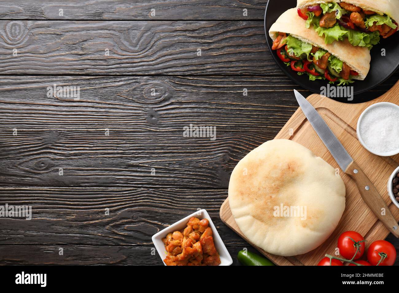 Concept of cooking pita with chicken on wooden background Stock Photo ...