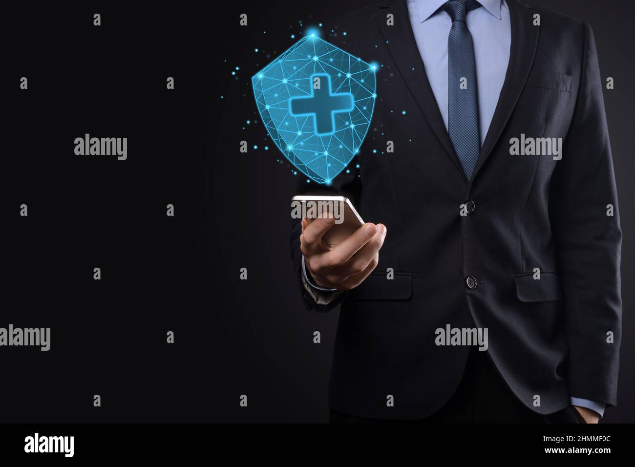 Businessman hold Shield with plus Low polygonal icon, medicine icon ...