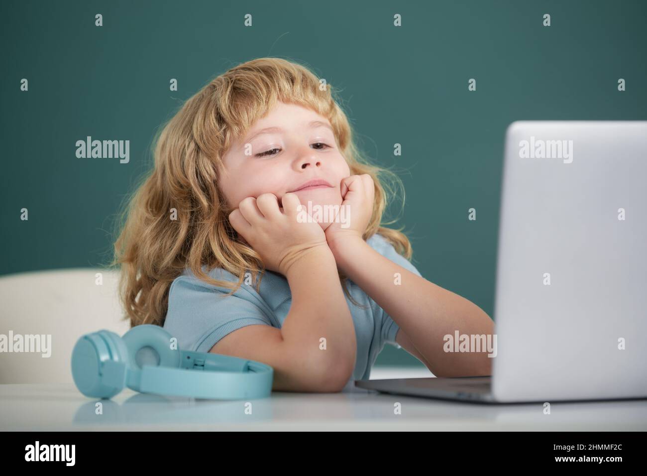 Boy student learning online in class. School boy dreaming on lesson ...