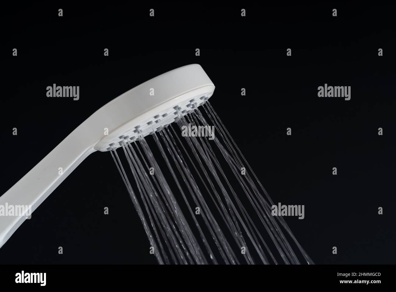 Water pouring from white shower head Stock Photo - Alamy