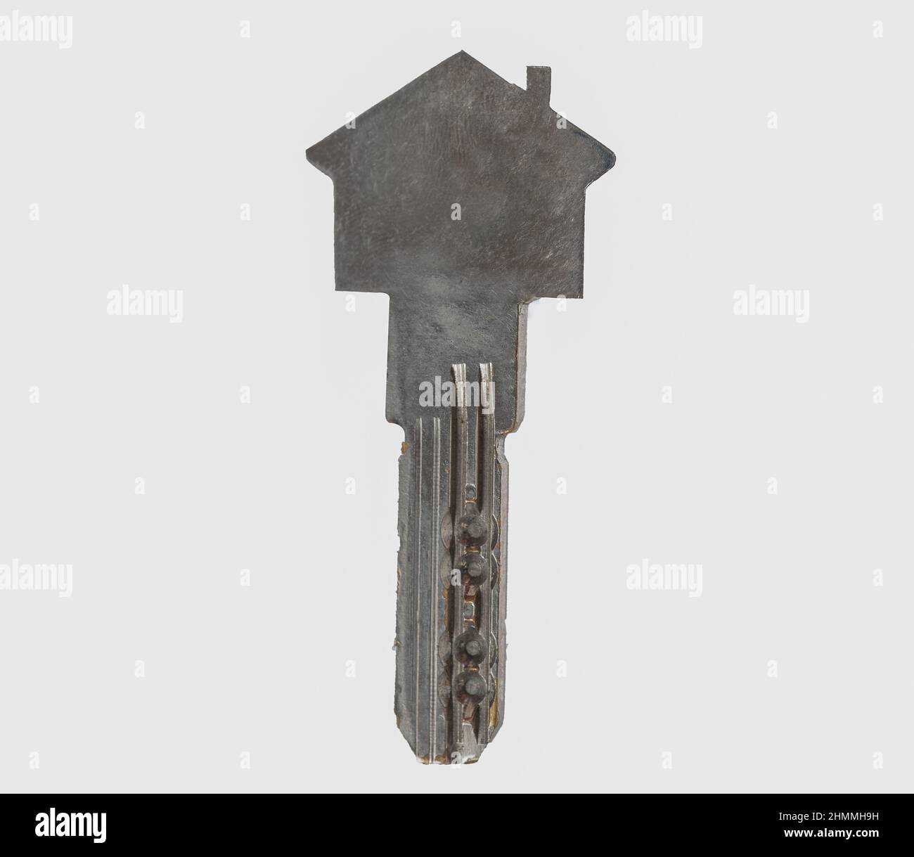 Close up photo of house shaped key on isolated background Stock Photo ...