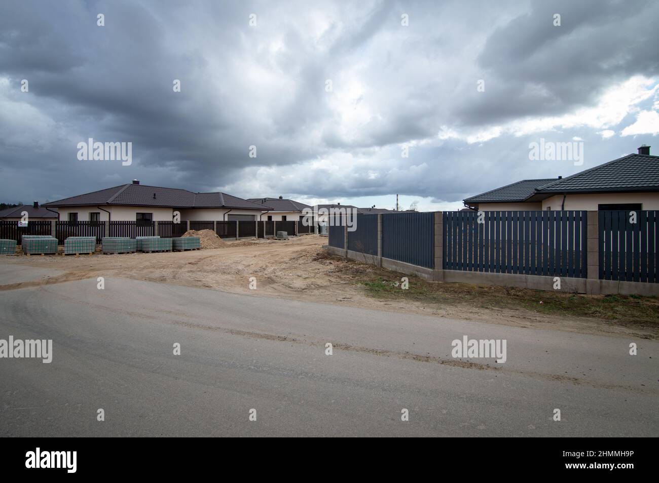 Construction works in a newly built residential village Stock Photo - Alamy